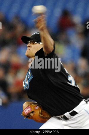 Toronto Blue Jays pitcher Gustavo Chacin winds up for a pitch against ...