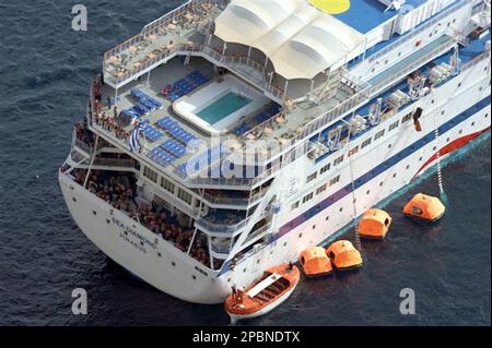 The listing cruise ship 'Sea Diamond' carrying nearly 1,200 passengers ...