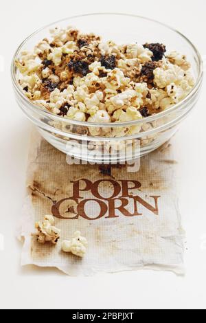 Burnt popcorn from a home microwave. Burn corn kernels on the kitchen ...