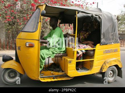Rickshaw with two women passengers on road near Dutch Square Melaka ...