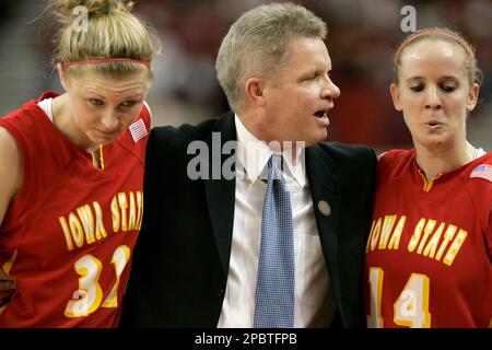 Iowa State's Lyndsey Medders, center, drives between Wisconsin-Green ...