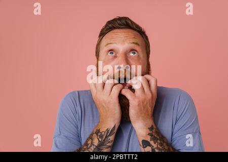 Ginger scared man with beard expressing surprise at camera isolated ...