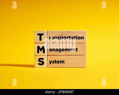 The acronym TMS transportation management system. Written on wooden ...
