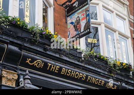 Pub sign on the front of The Bishop's Finger public house and ...