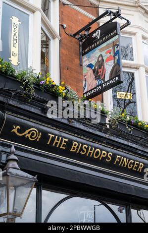 Pub sign on the front of The Bishop's Finger public house and ...
