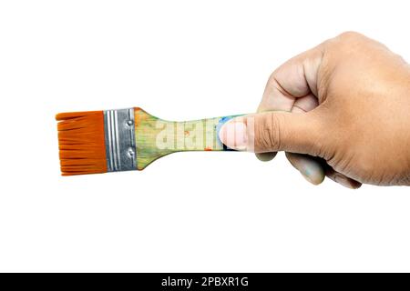 Human hand holding dirty paintbrushes isolated over white background ...