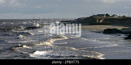 A view of the northeastern coastal village of Happisburgh, in Norfolk ...