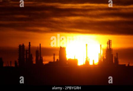 The sun rises behind the Valero McKee Refinery, where a small fire ...