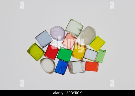 heap of several different transparent colored plastic polymer resins ...
