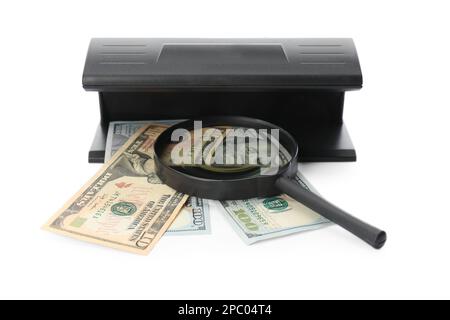 Modern currency detector with dollar banknotes and magnifying glass on ...