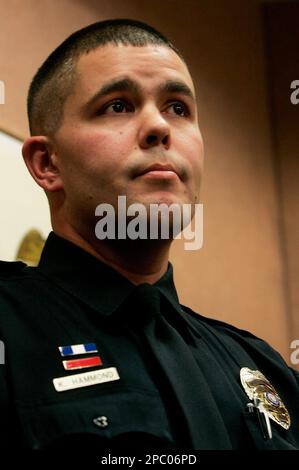Ogden City Master Officer Ken Hammond reacts to being given a medal of ...