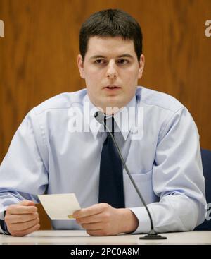 Mike Halbach, brother of Teresa Halbach, holds a photo of his sister ...