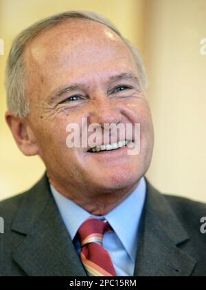 Former Massachusetts Attorney General Tom Reilly, right, reacts when ...