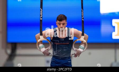 Illinois gymnast Josh Cook competes on the vault of an NCAA gymnastics ...