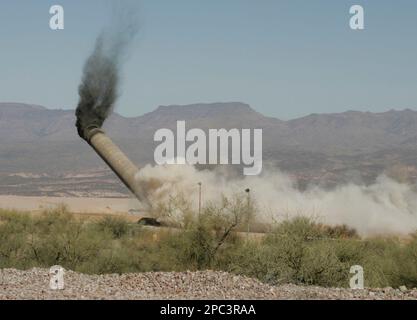 The smelter stacks at the former Magma Copper complex fall during ...