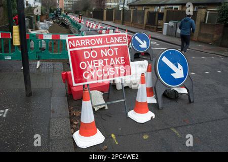 narrow lane do not overtake cyclists sign at road works in teddington ...