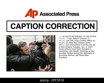 Sgt. Robert Gisevius Jr., left, hugs a fellow officer as he and six ...