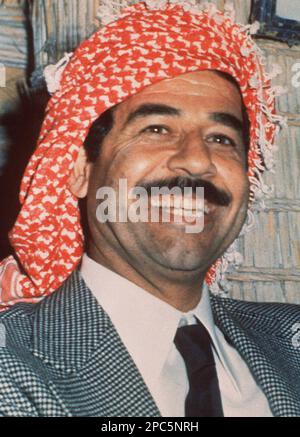 FILE - In this undated file photo, Iraqi ruler Saddam Hussein poses ...