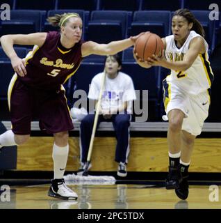Arizona State's Aubree Johnson, right, tries to put up a shot past ...