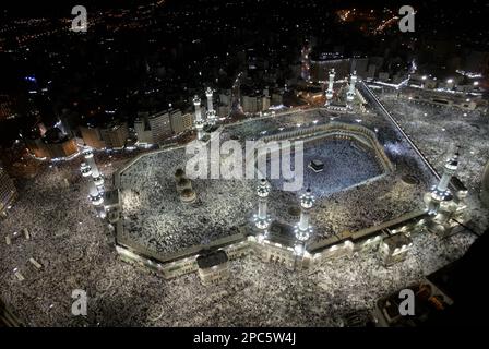 Tens of thousands of Muslim pilgrims attend the afternoon prayers ...