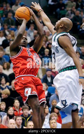 Minnesota Timberwolves' Trenton Hassell, left, and Craig Smith, right ...