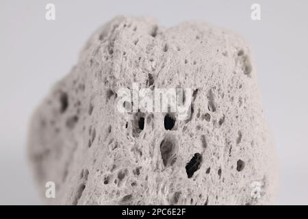 Pumice is a volcanic rock that consists of highly vesicular rough ...