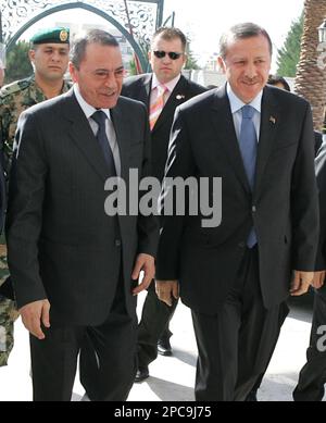 Turkish Prime Minister Recep Tayeb Erdogan, left, gestures during a ...