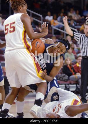 Southern California's Morghan Medlock, center, tries to drive to the ...