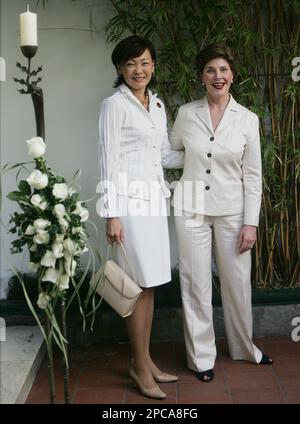 HANOI, Vietnam - Akie Abe (L) Laura Bush, the first ladies of Japan and ...