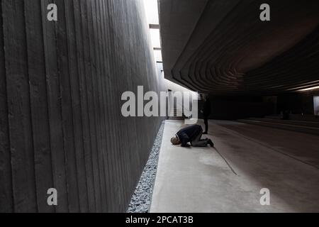 Ramadan concept photo. Praying muslim man with Holy Quran in the mosque ...