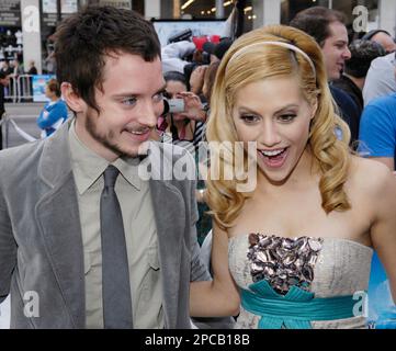 Elijah Wood, left, and Brittany Murphy, center, who provide voices for ...