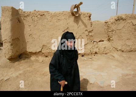 73-year-old Safiya Ahmed Hussain stands near her former home in Dujail ...