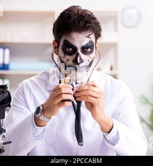 The scary monster doctor working in lab Stock Photo - Alamy