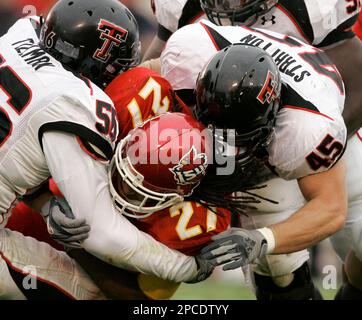 Iowa State's Stevie Hicks, left, runs from Kansas State defender Jesse ...
