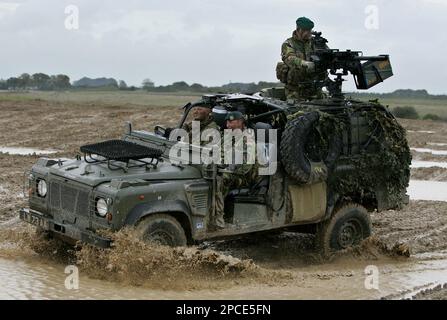 British Royal Marines display a new grenade machine gun mounted on a ...