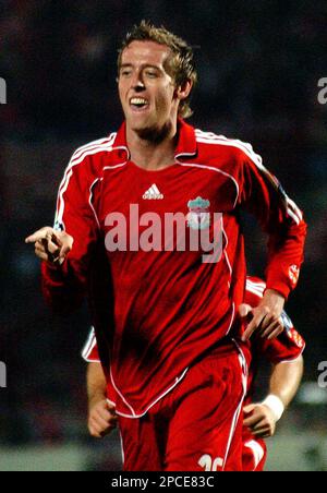 Liverpool's Peter Crouch reacts after scoring his team third goal ...