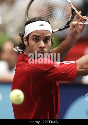 Chile's Fernando Gonzales returns a ball to Argentina's David ...
