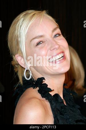 Sharon Stone poses as she arrives at the 2nd annual Tea at High Noon ...
