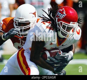 Iowa State's Stevie Hicks, right, is tackled by Texas A&M's Jonte Buhl ...
