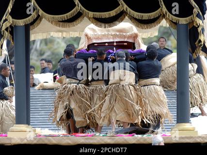 The catafalque bearing the casket of King Taufa'ahau Tupou, moves ...