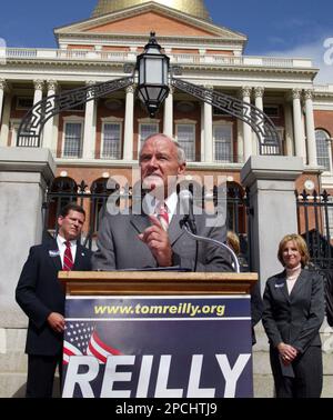 Former Massachusetts Attorney General Tom Reilly, right, reacts when ...