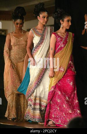Pakistani models present creations of designer Yasmin Zaman during the ...