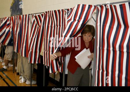 Republican candidate for Congress Martha Rainville, left, checks in to ...