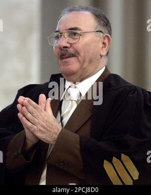 Defence lawyer Badie Aref speaks to the chief judge during the trial of ...