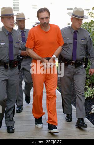 Chemung County Sheriffs escort Ralph "Bucky" Phillips toward the ...