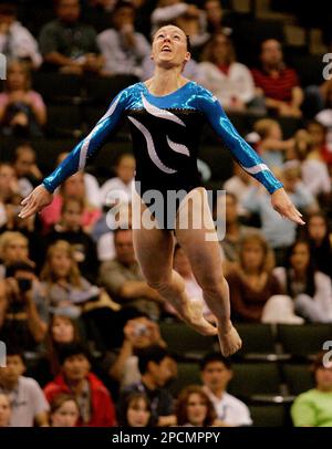 Chellsie Memmel of the United States performs on the uneven bars during ...