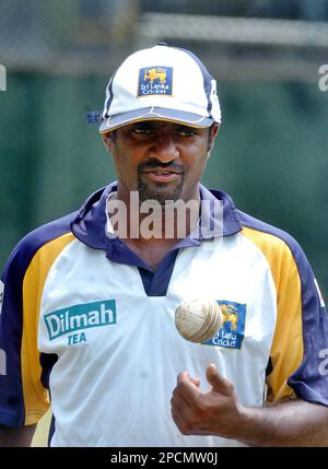 Sri Lankan cricketer Muttaiah Muralitharan, right, talks to his wife ...