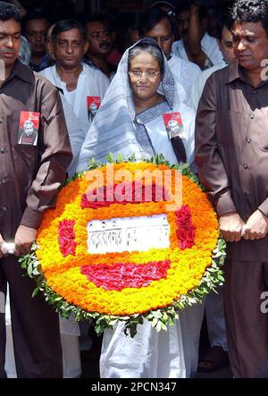 Bangladesh opposition leader Sheikh Hasina, right, prays at the ...