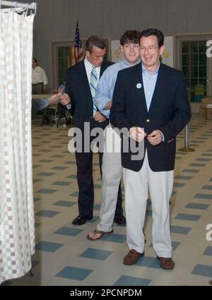 Stamford Mayor Dannel Malloy, center, talks to the media after voting ...