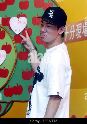 Hong Kong actor and singer Jordan Chan, left, and his actress wife ...